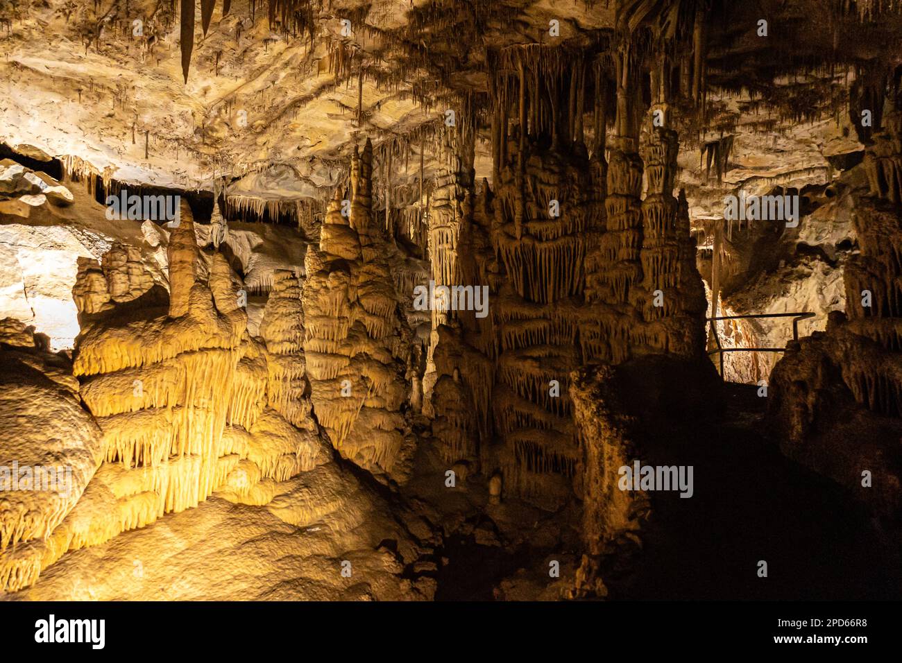 Inside a cave with calcium carbonate rock formation with stalactites ...