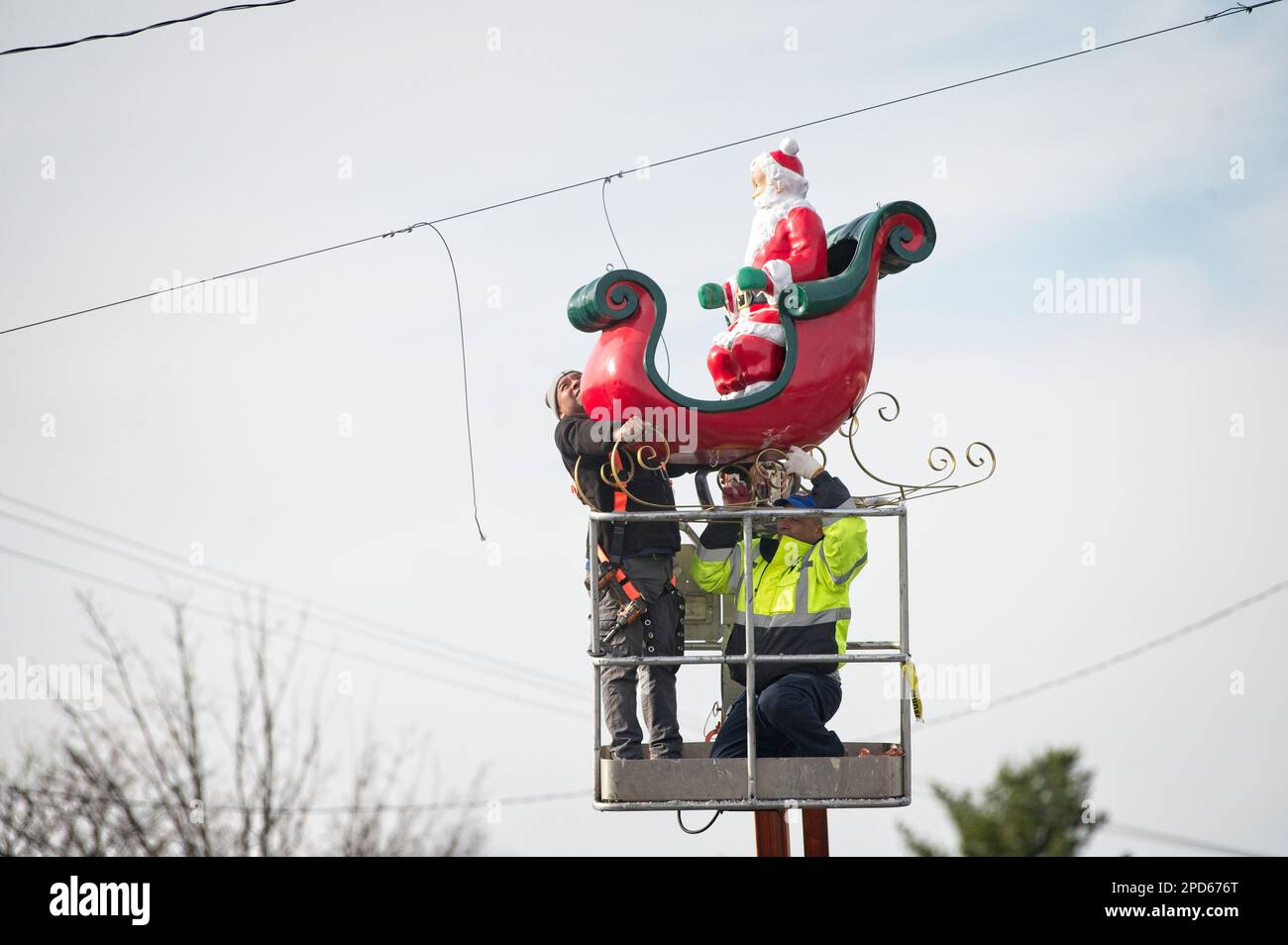 United States:11-29-2022; Town workers set up Santa in his Sleigh at ...