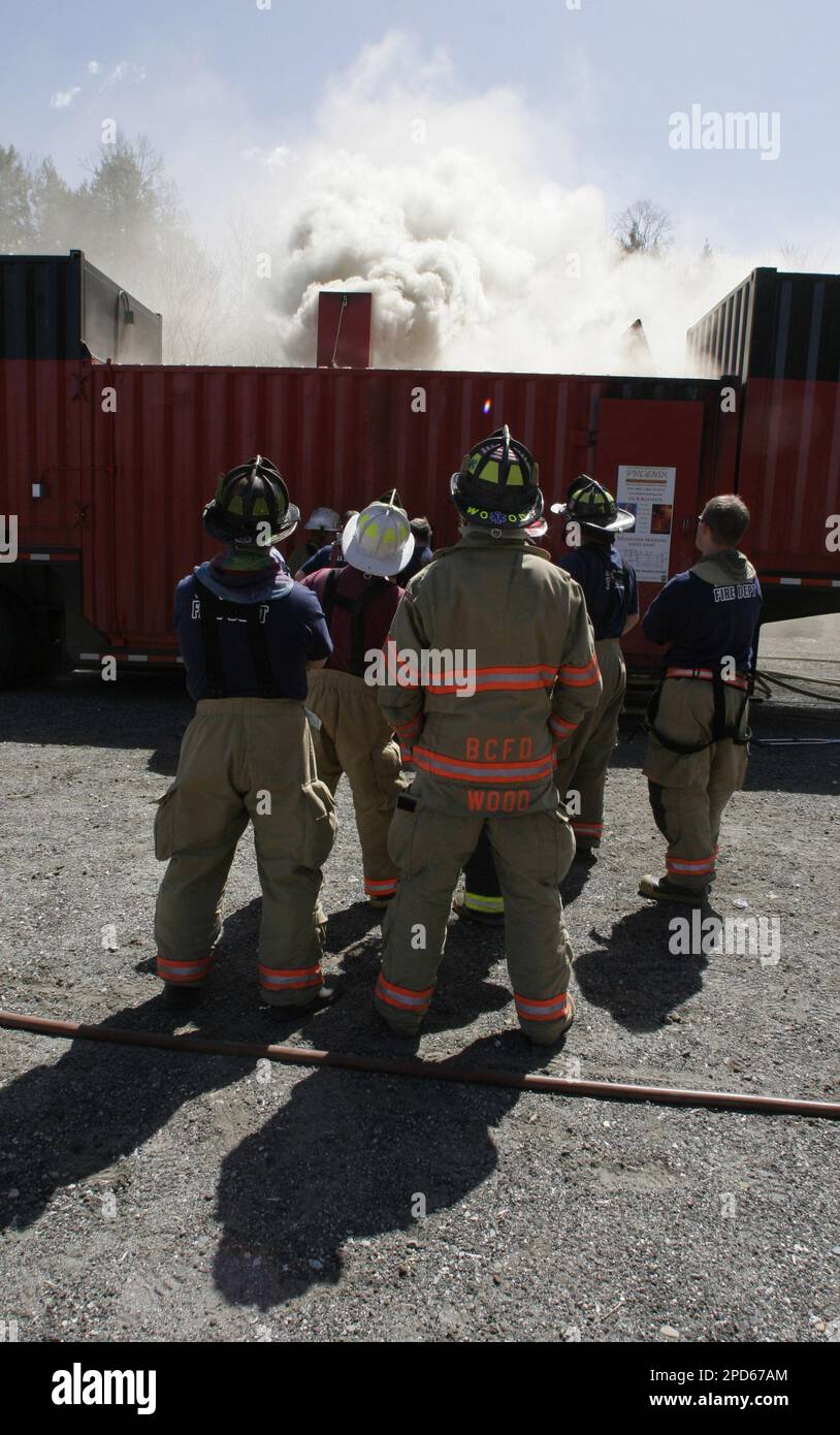 Barre City firefighters watch outside a smoking flashover fire training ...