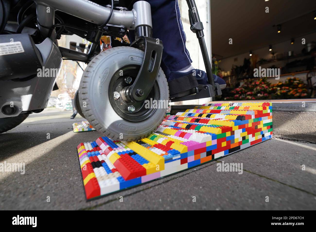 Hamburg, Germany. 14th Mar, 2023. Wheelchair user Inge Janke drives ...