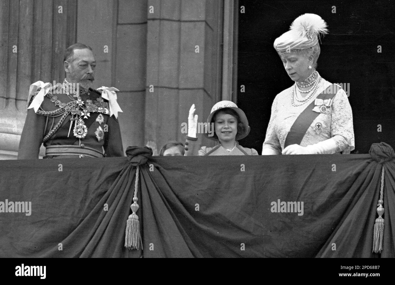 Britain's Queen Elizabeth II, then Princess Elizabeth, centre, waves as ...