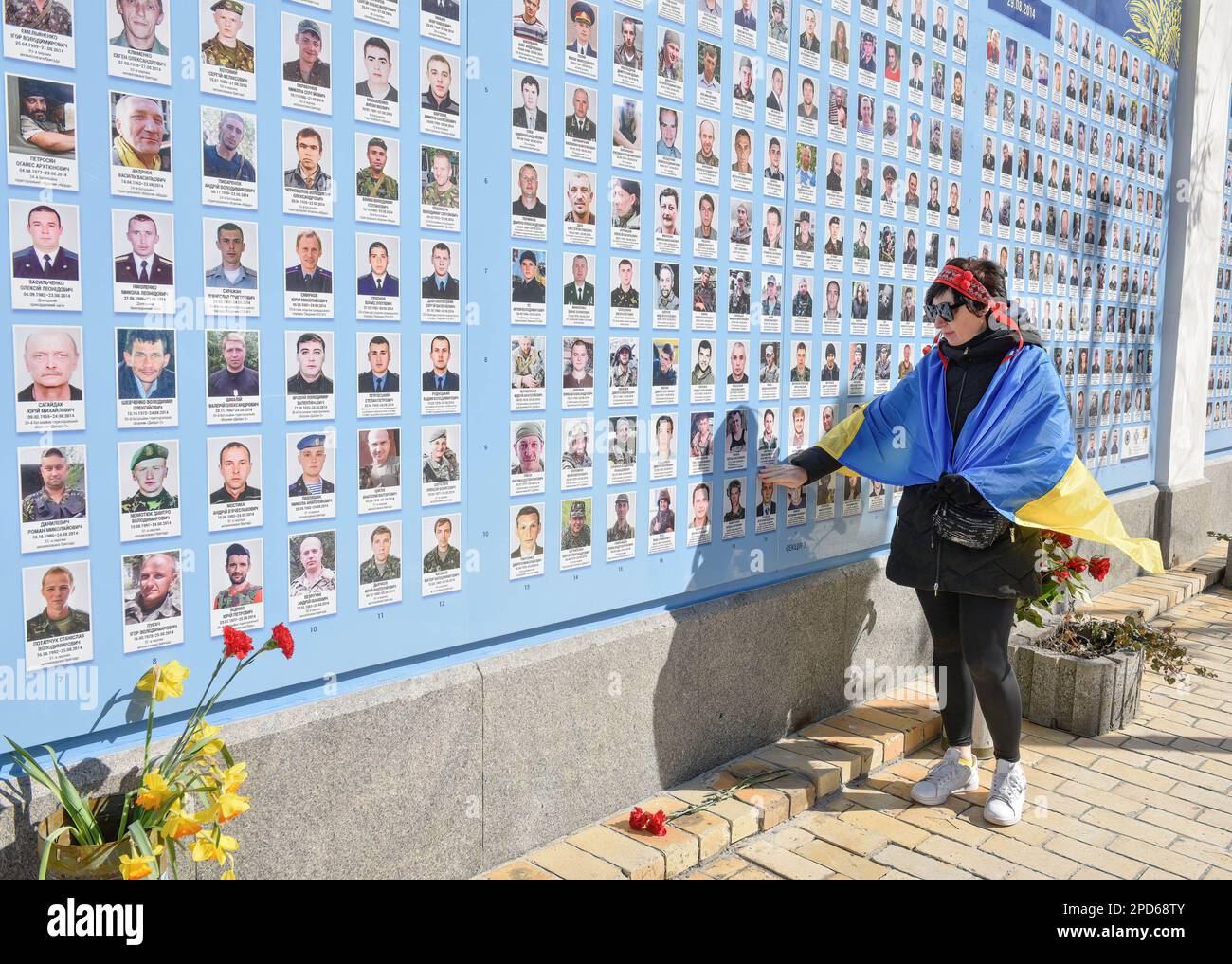 Kyiv, Ukraine. 14th Mar, 2023. A woman wrapped in a Ukrainian flag ...