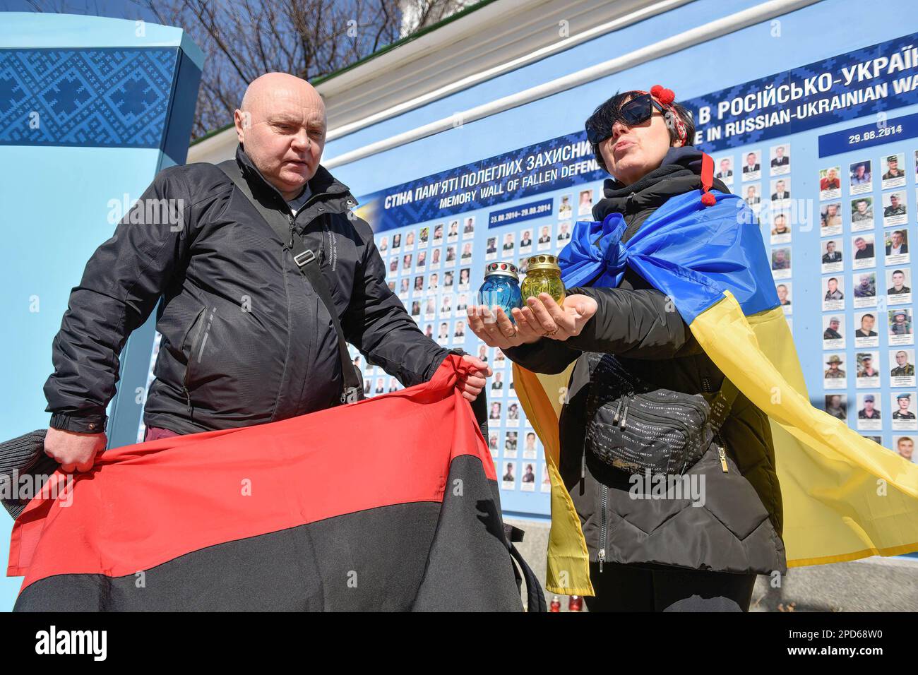 Kyiv, Ukraine. 14th Mar, 2023. People with lamps and flags of Ukraine ...