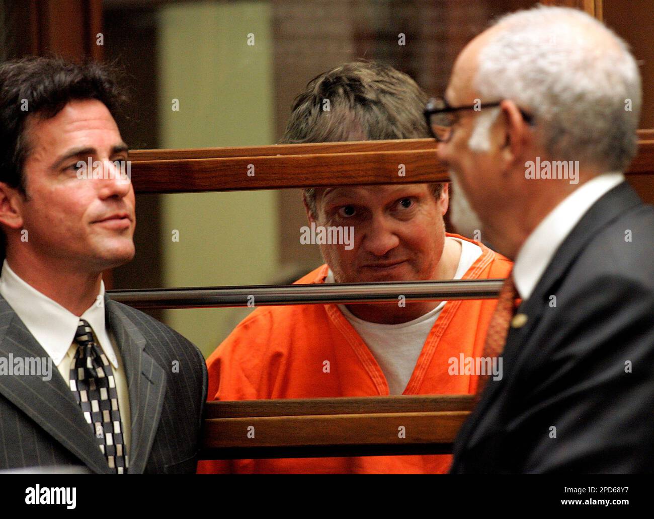 Swedish businessman Bo Stefan M. Eriksson, center, listens to his ...