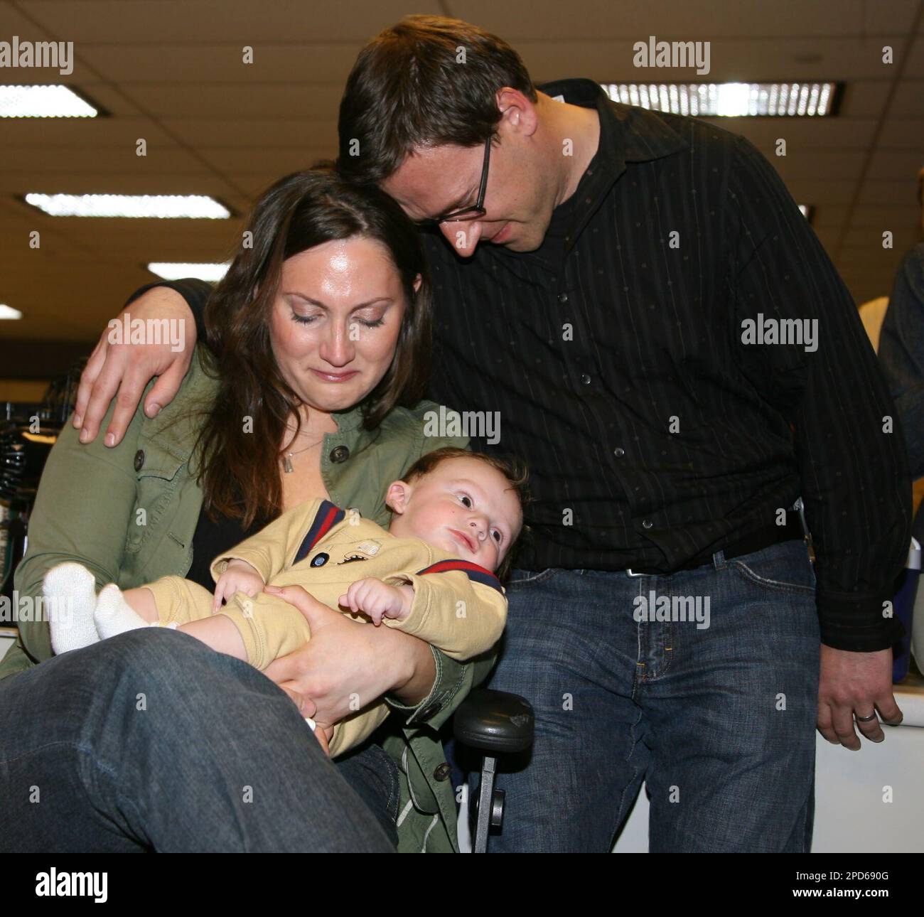 With her son, Jimmy, on her lap, Katherine Cathey, the widow of U.S ...