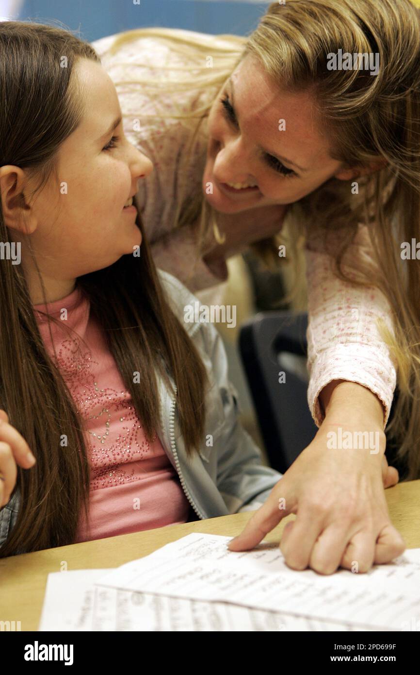 Teacher Bethany Sherrill, right, works with student Alyson Simpson ...