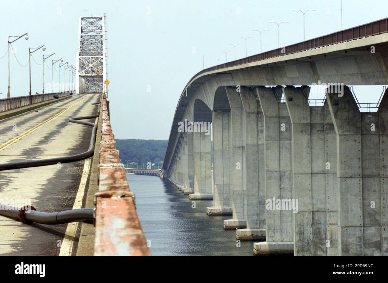 **FILE** The old Jamestown Bridge, left, stands rusted and unused ...