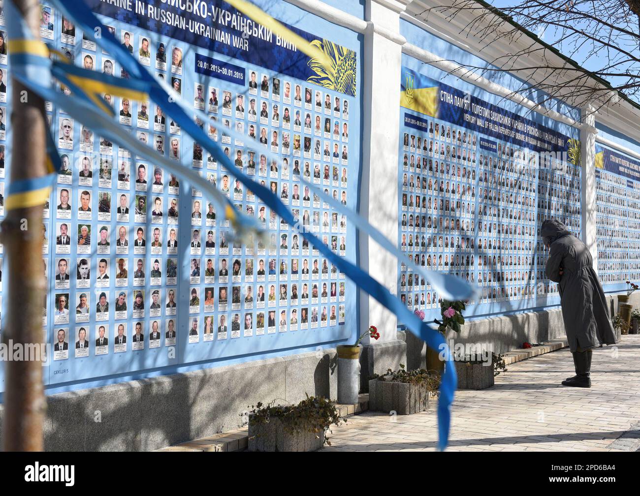 Kyiv, Ukraine. 14th Mar, 2023. A woman mourns at the wall of memory ...