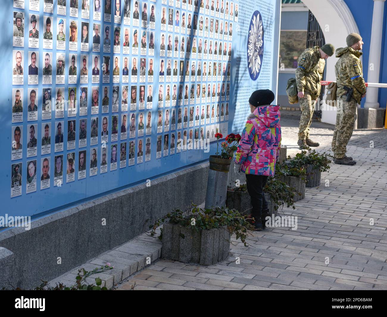 Kyiv, Ukraine. 14th Mar, 2023. A child at the wall of memory of those ...