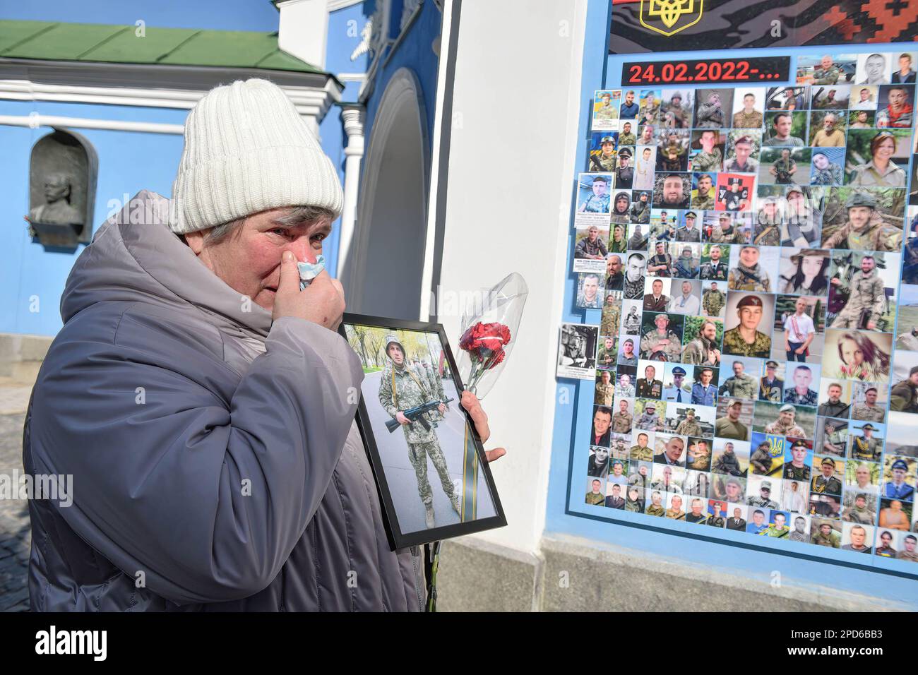Kyiv, Ukraine. 14th Mar, 2023. A woman cries with a portrait of her son ...