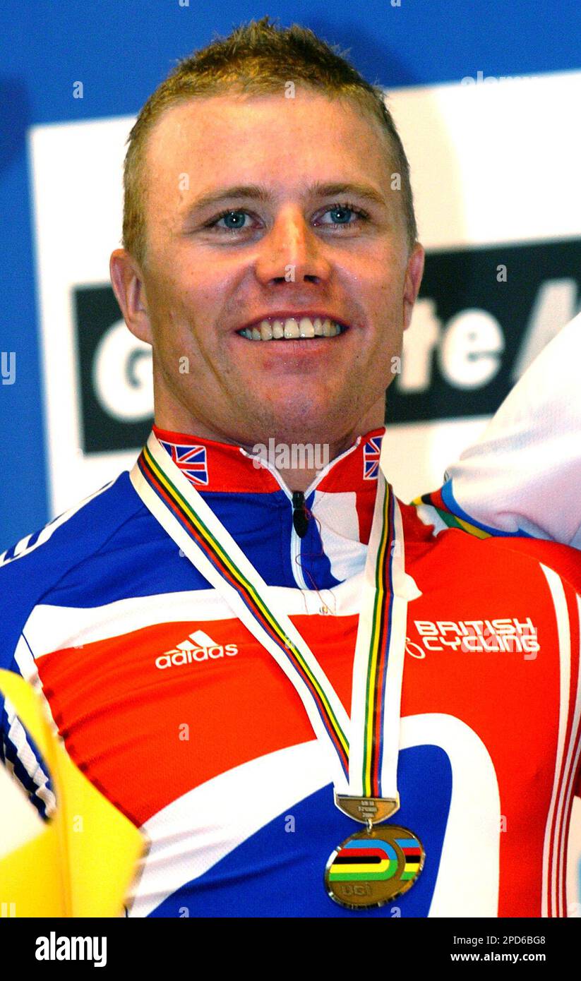 Great Britain's Craig Maclean stands on the podium after he won a ...