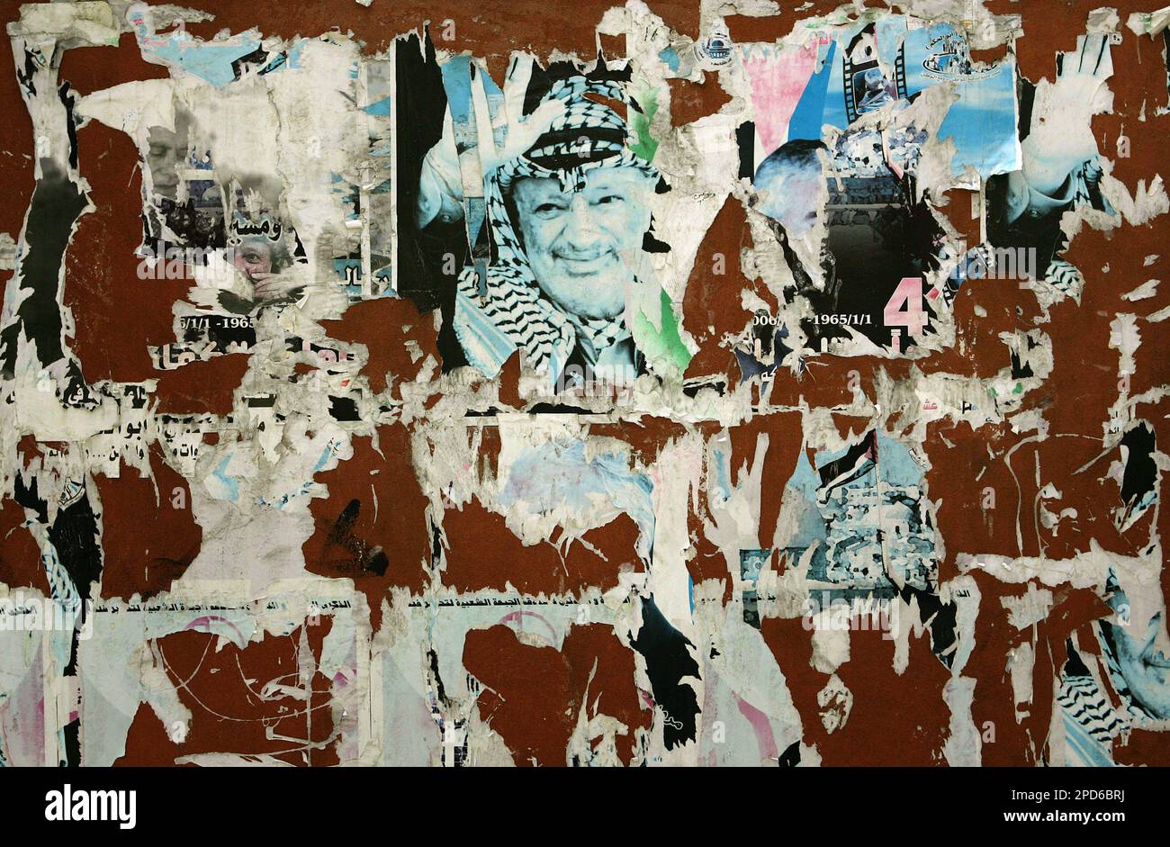 Old posters showing the late Palestinian leader Yasser Arafat are seen ...