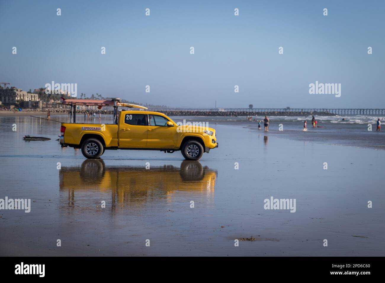 Yellow lifeguard truck on beach Stock Photo - Alamy