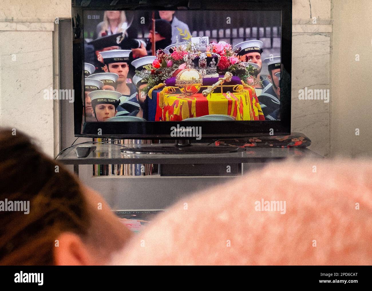 Woman watching the funeral of Queen Elizabeth II live on the BBC, 19th ...