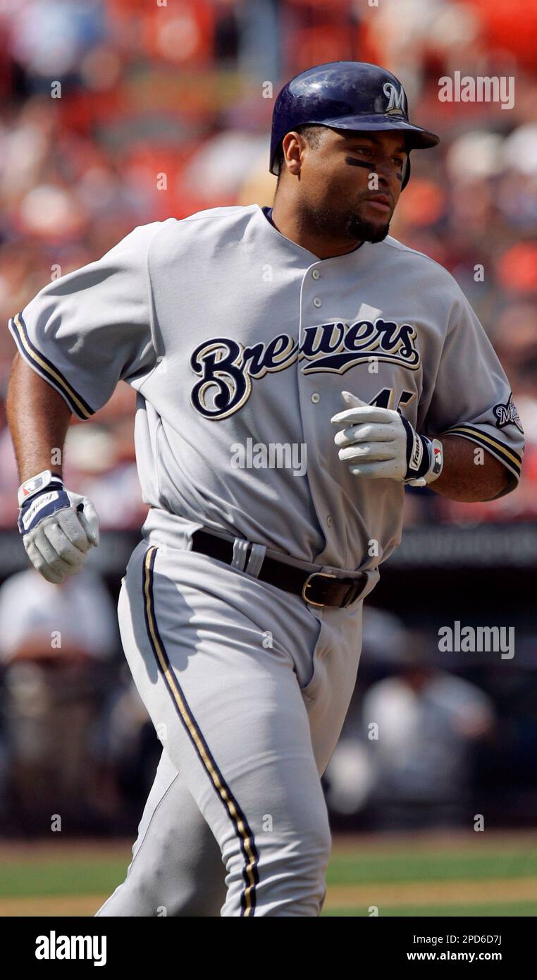 Milwaukee Brewers' Carlos Lee (45) heads to first base after hitting a ...