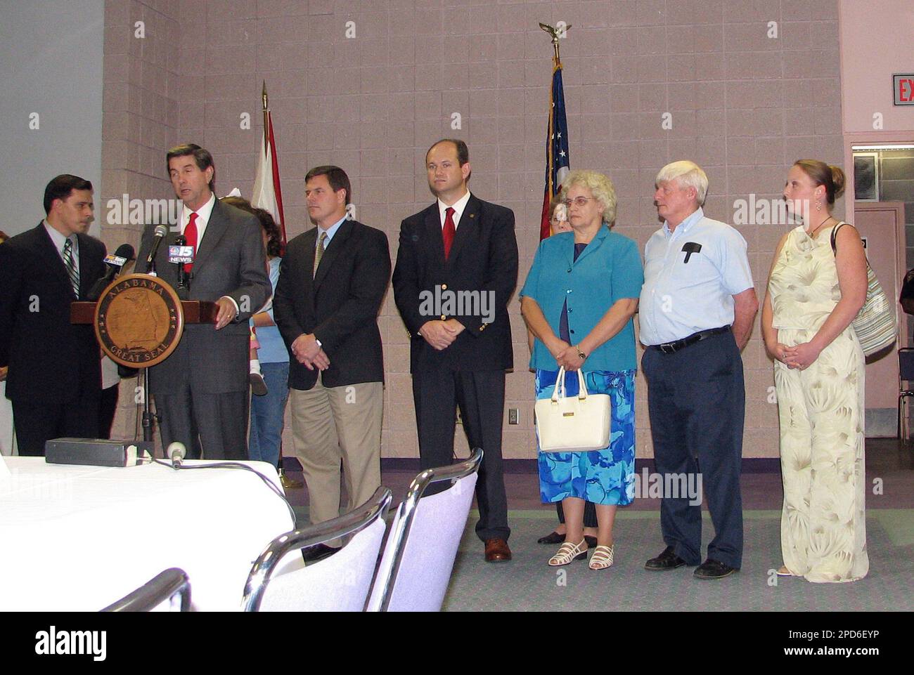 Alabama Gov. Bob Riley, at podium, with legislators and victims ...