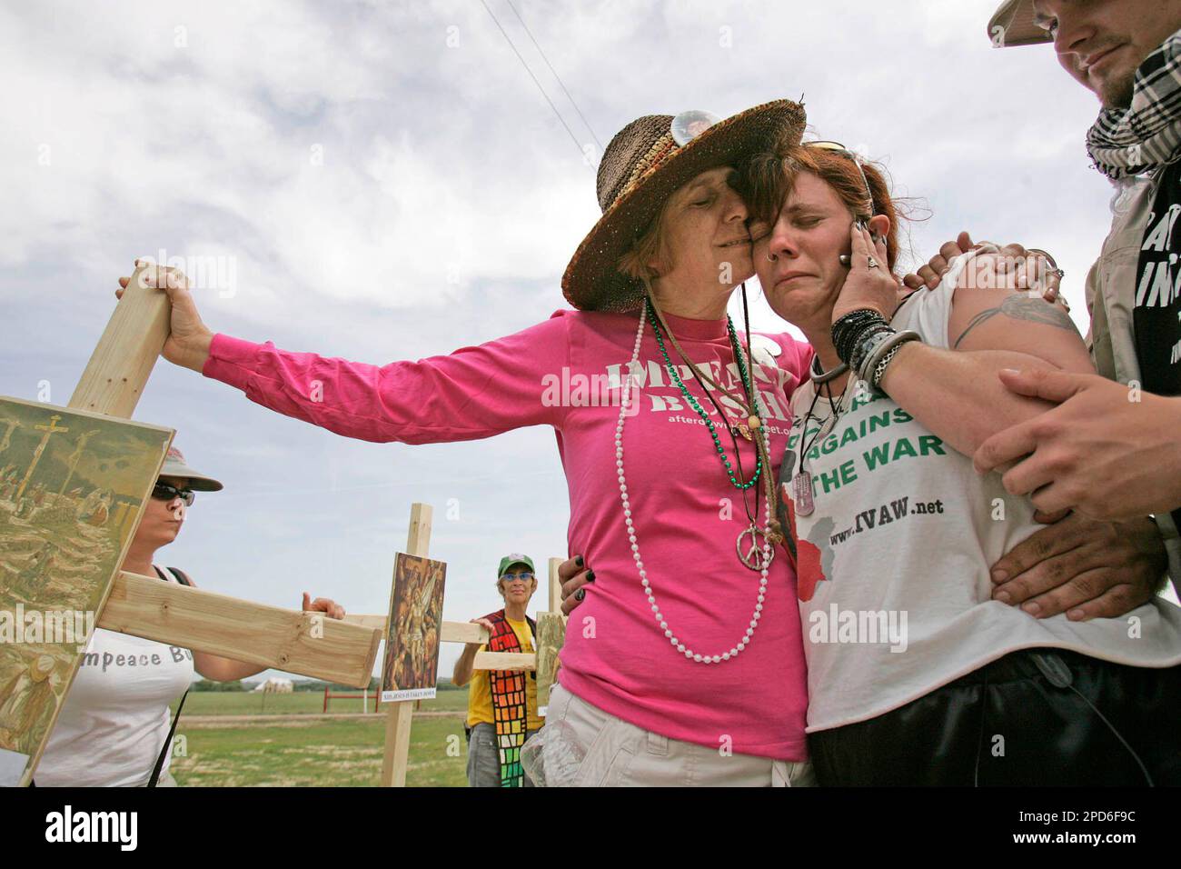War protestor Cindy Sheehan, left, comforts Tammara Rosenleaf as she ...