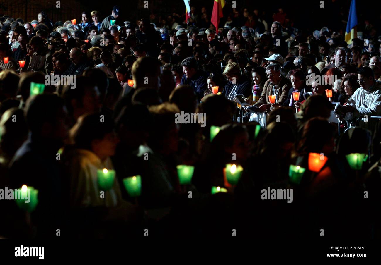 Faithful hold their candles during the Via Crucis (Way of the Cross ...