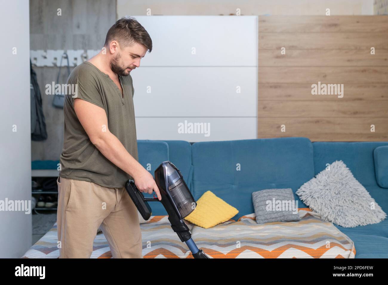 Man husband cleaning the house helping wife Stock Photo - Alamy