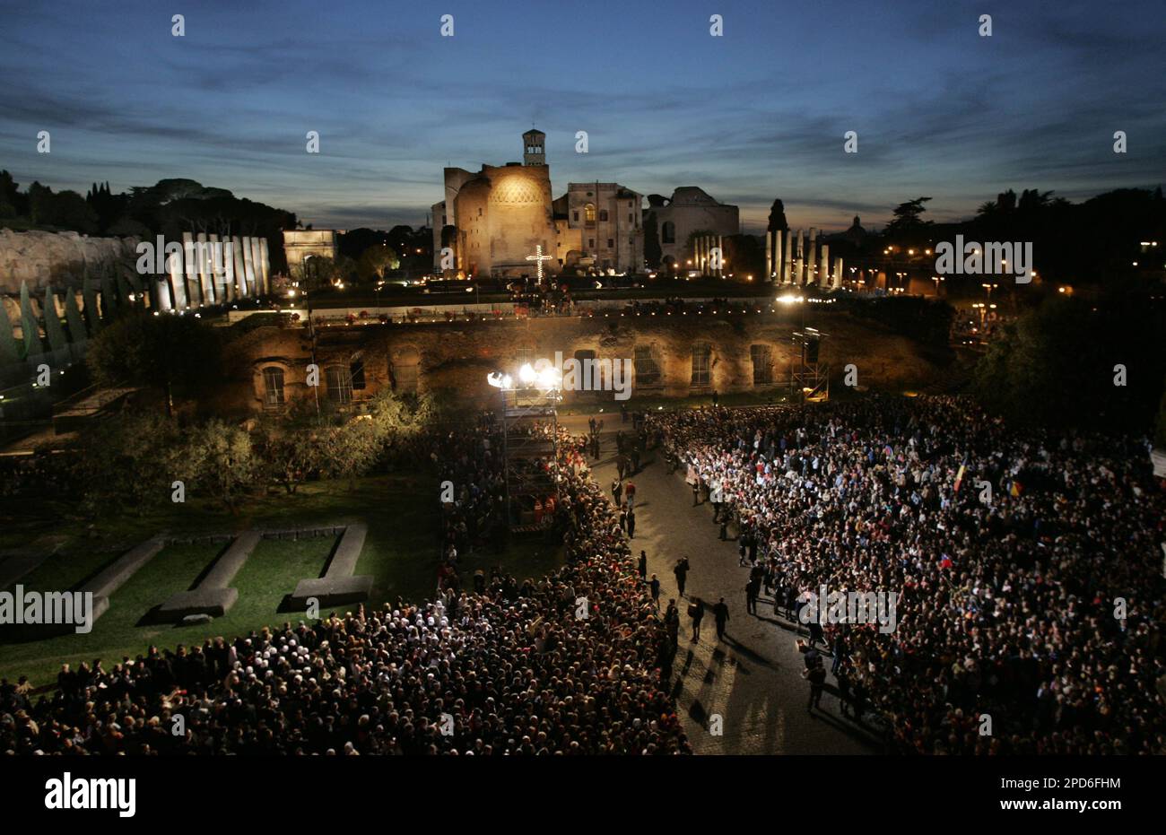 Faithful gather in front of Rome's Colosseum(not shown) for the Via ...