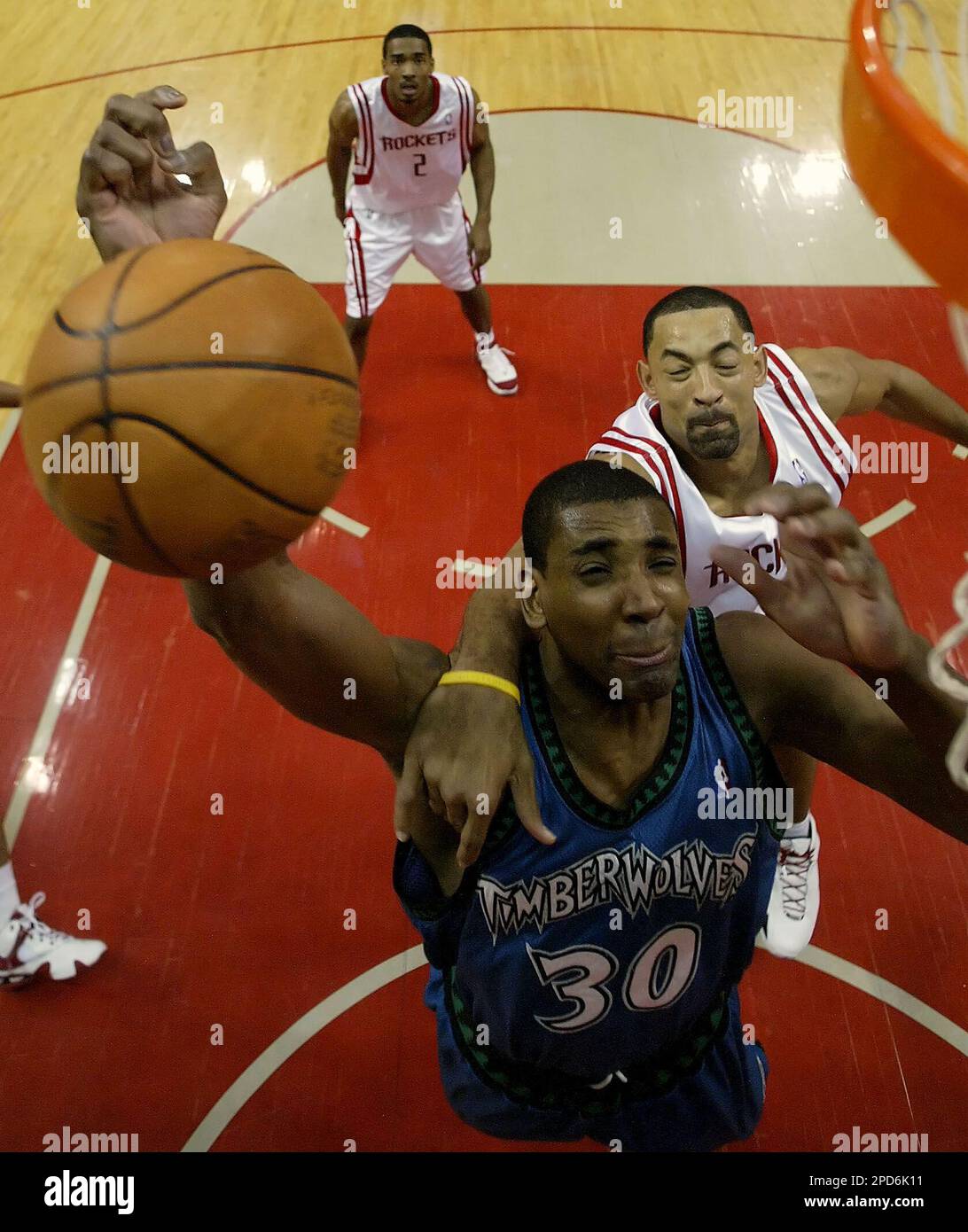Minnesota Timberwolves' Mark Blount (30) is fouled by Houston Rockets ...