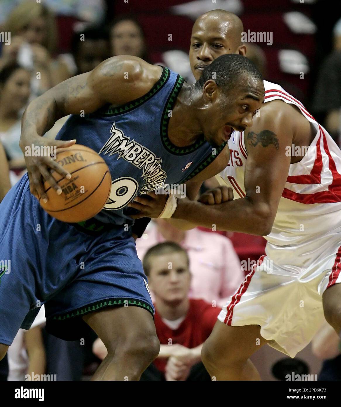Minnesota Timberwolves' Justin Reed (9) drives around Houston Rockets ...