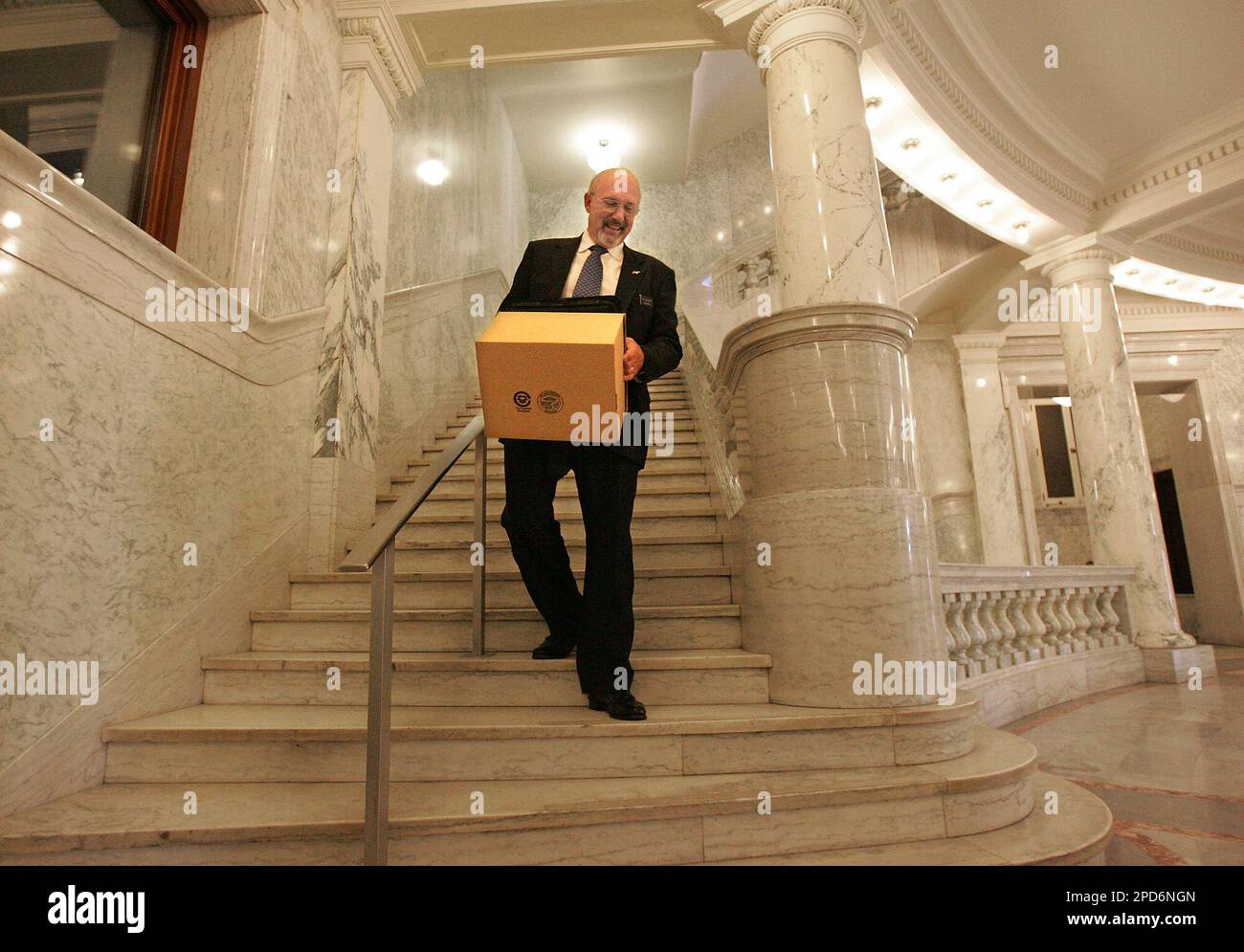 Rep. Leon Smith, R-Twin Falls, walks down the stairs of the State ...