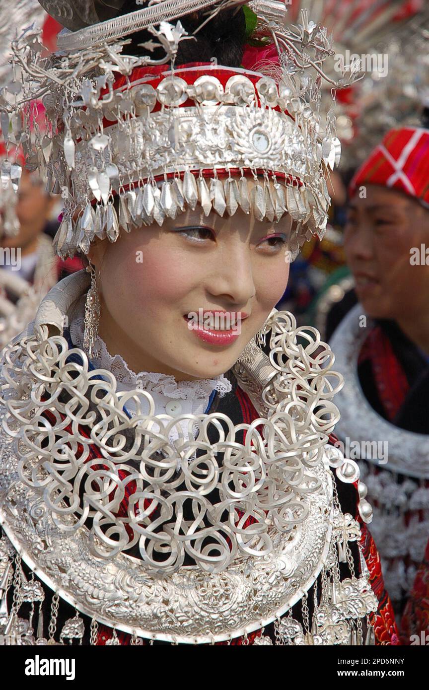 In this photo released by China's Xinhua news agency, a girl of the ...