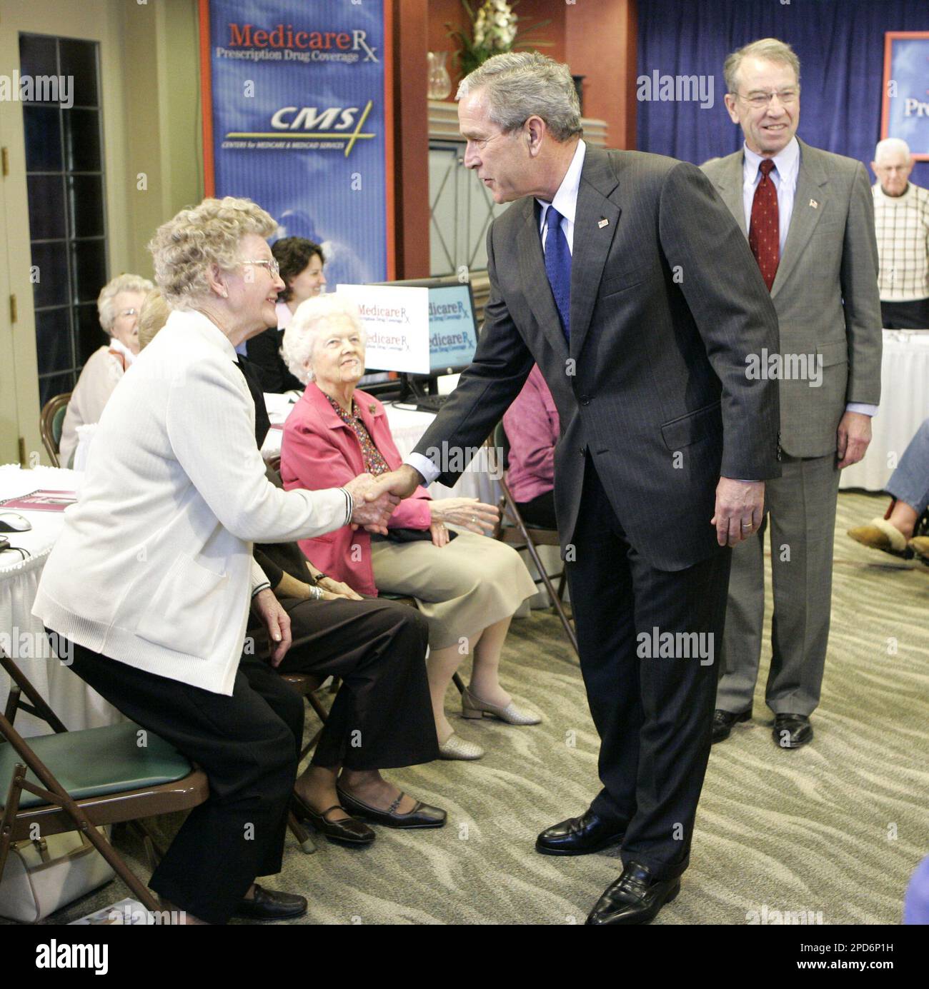 President Bush greets people during a visit to the Wesley Acres Senior ...