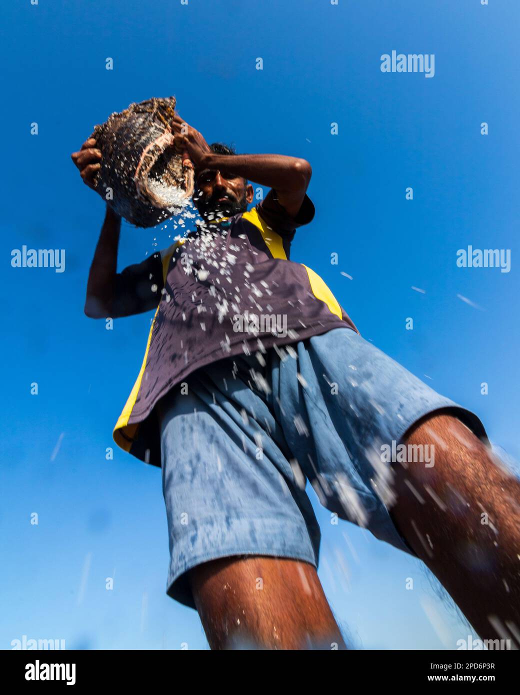 Bhambore Sindh Pakistan 2022, Labor collecting and stacking sea salt at ...