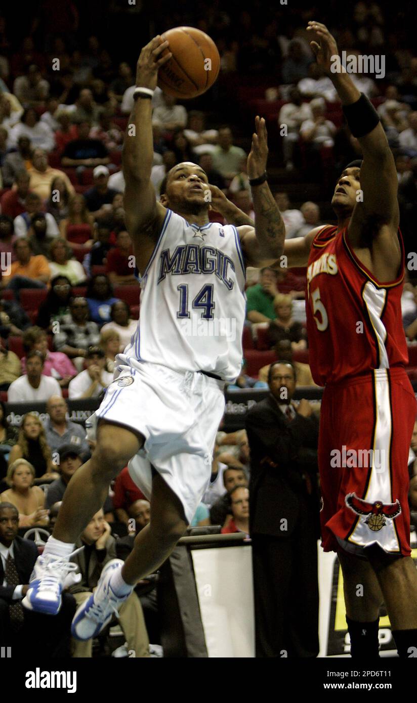 Orlando Magic's Jameer Nelson (14) gets past Atlanta Hawks' Josh Smith ...