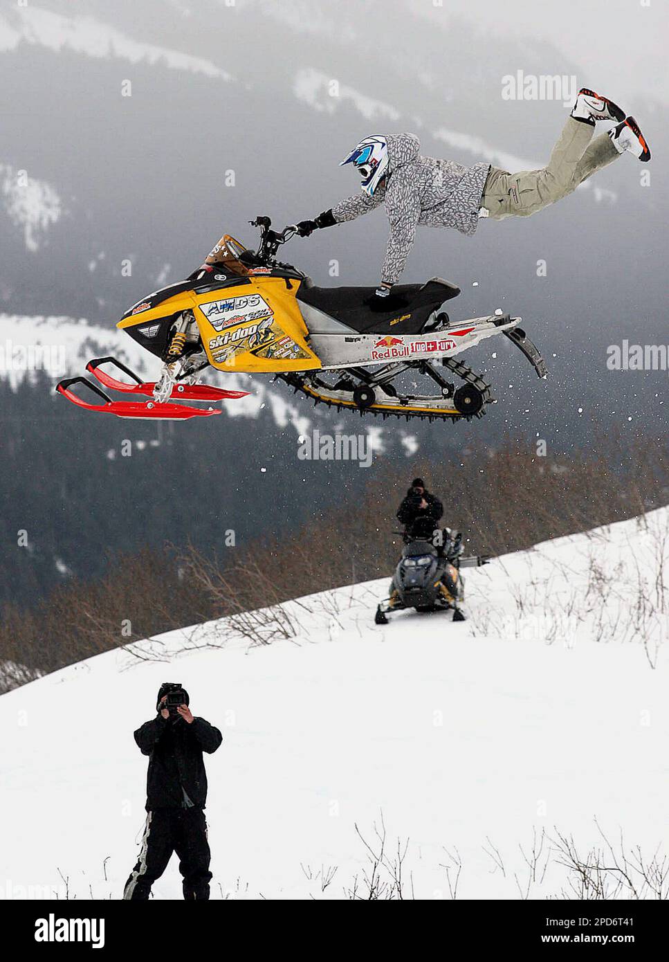 Kyle Armbrust of Anchorage, Alaska, performs a stunt on his snow ...