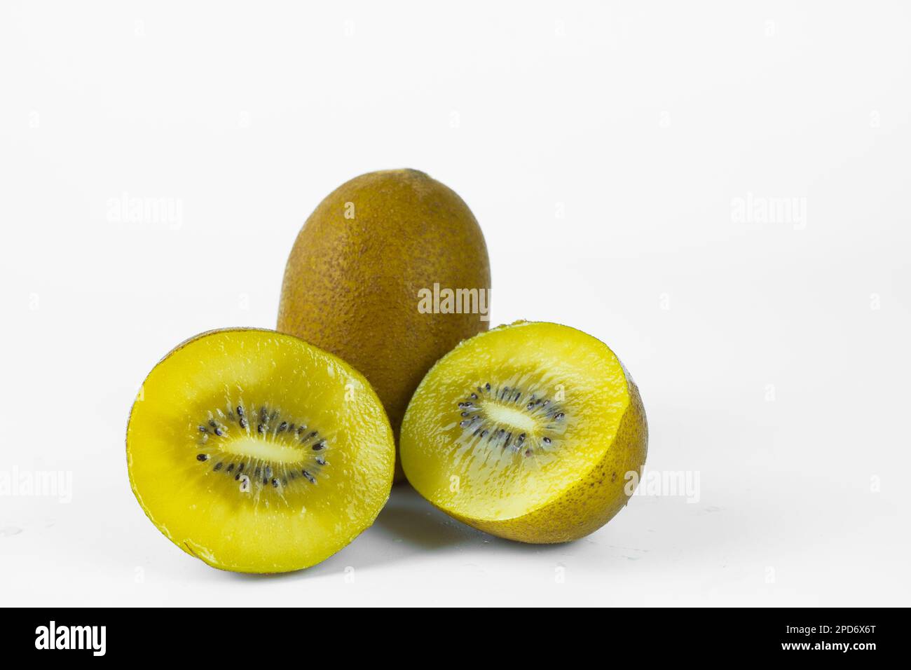 Whole and sliced golden kiwi fruit isolated on white background. Copy ...