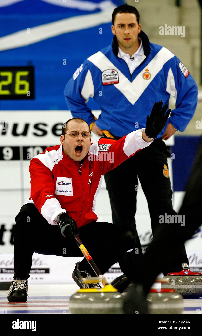 Canada's skip Jean-Michel Menard shouts to his sweeps as Scotland's ...