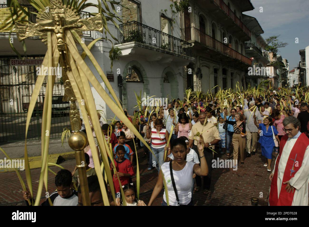 Faithful Christians participate in a procession through Casco Antiguo ...