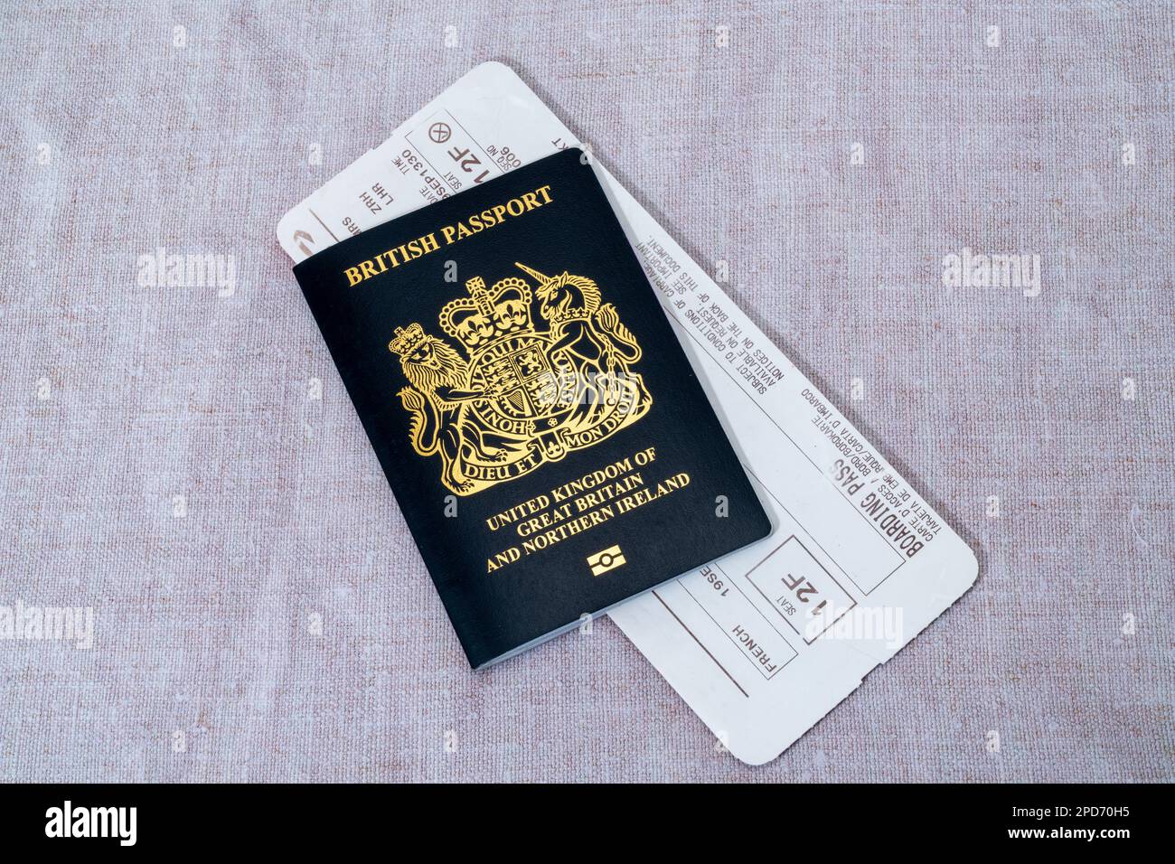 A new blue British passport with an airline boarding pass Stock Photo ...