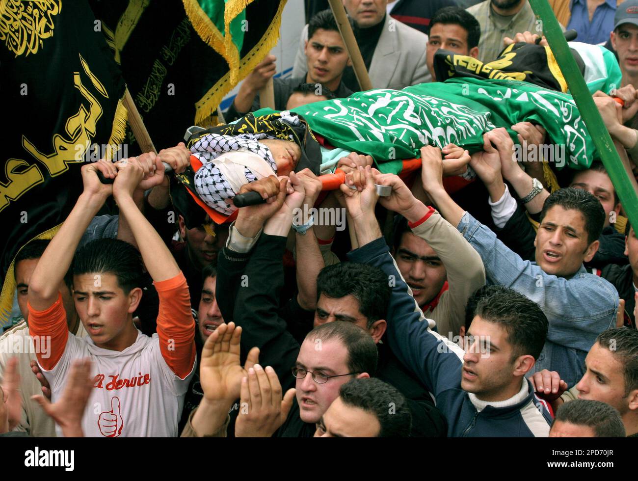 The Palestinian youth Sameh el-Shafi, 17, is carried for burial in the West Bank town of Nablus ...