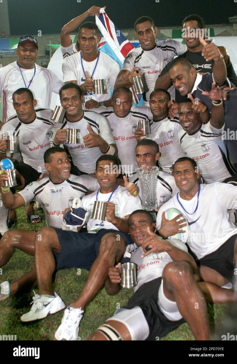 Team Fiji celebrate after beating England 40-21 in the Singapore Sevens ...