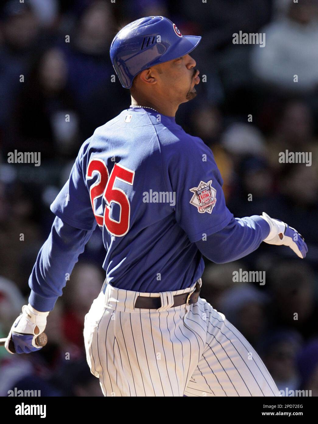 Chicago Cubs' Derrek Lee watches as his solo home run sails out of the ...