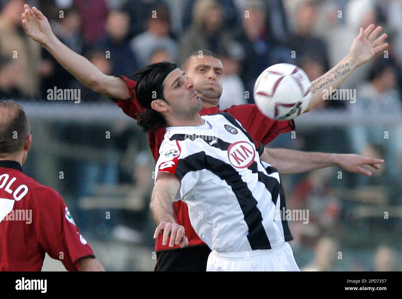 Livorno's Dario Passoni, background, and Udinese's Vincenzo Iaquinta in ...