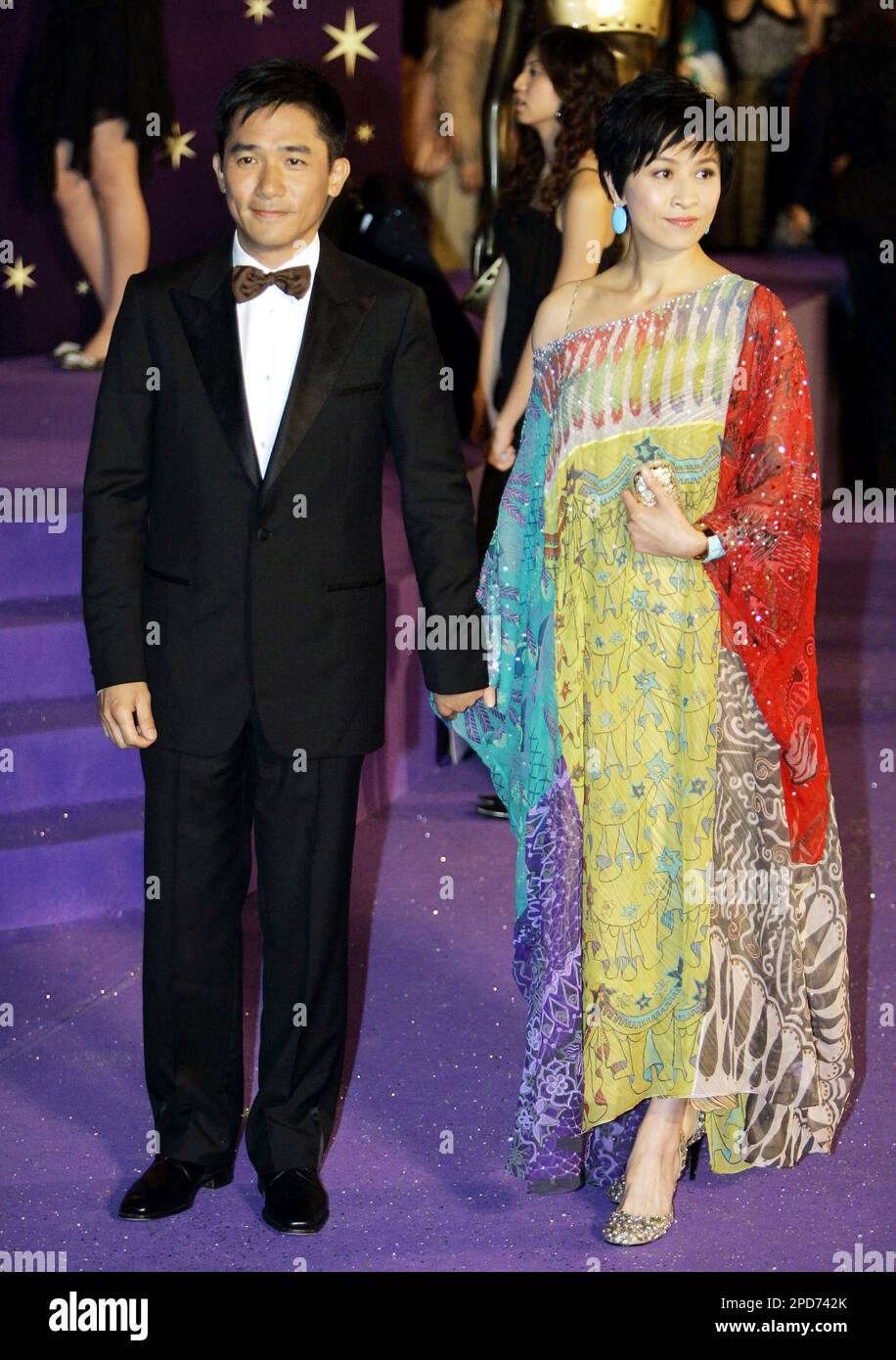 Hong Kong actor Tony Leung, left, and actress Carina Lau arrive at the ...
