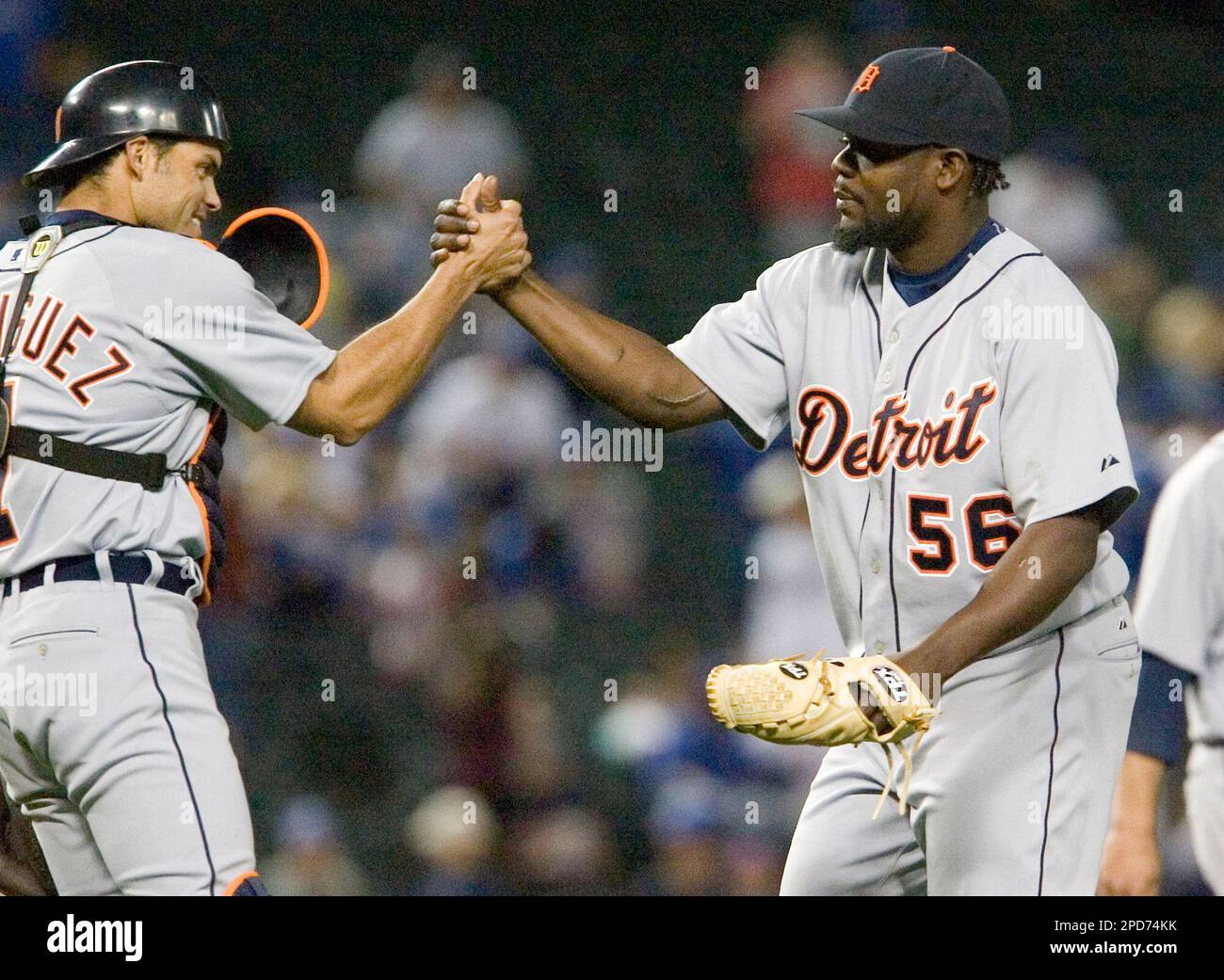 Detroit Tigers catcher Ivan Rodriguez, left, congratulates Tigers ...