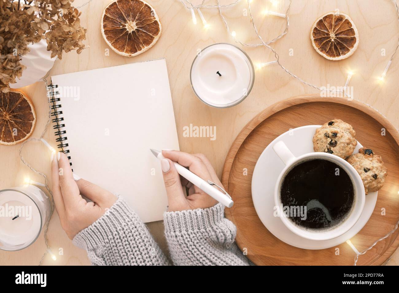 Back to life, goal list concept. Woman's hand writing in empty notebook ...