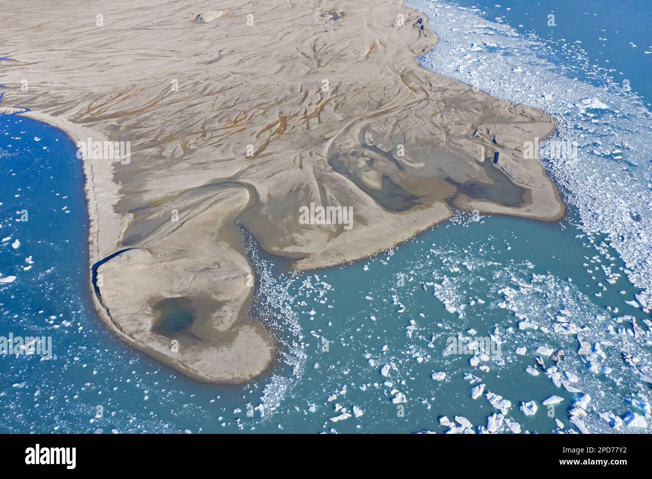 Aerial view of floating drift ice / icebergs in Recherche Fjord, coming ...