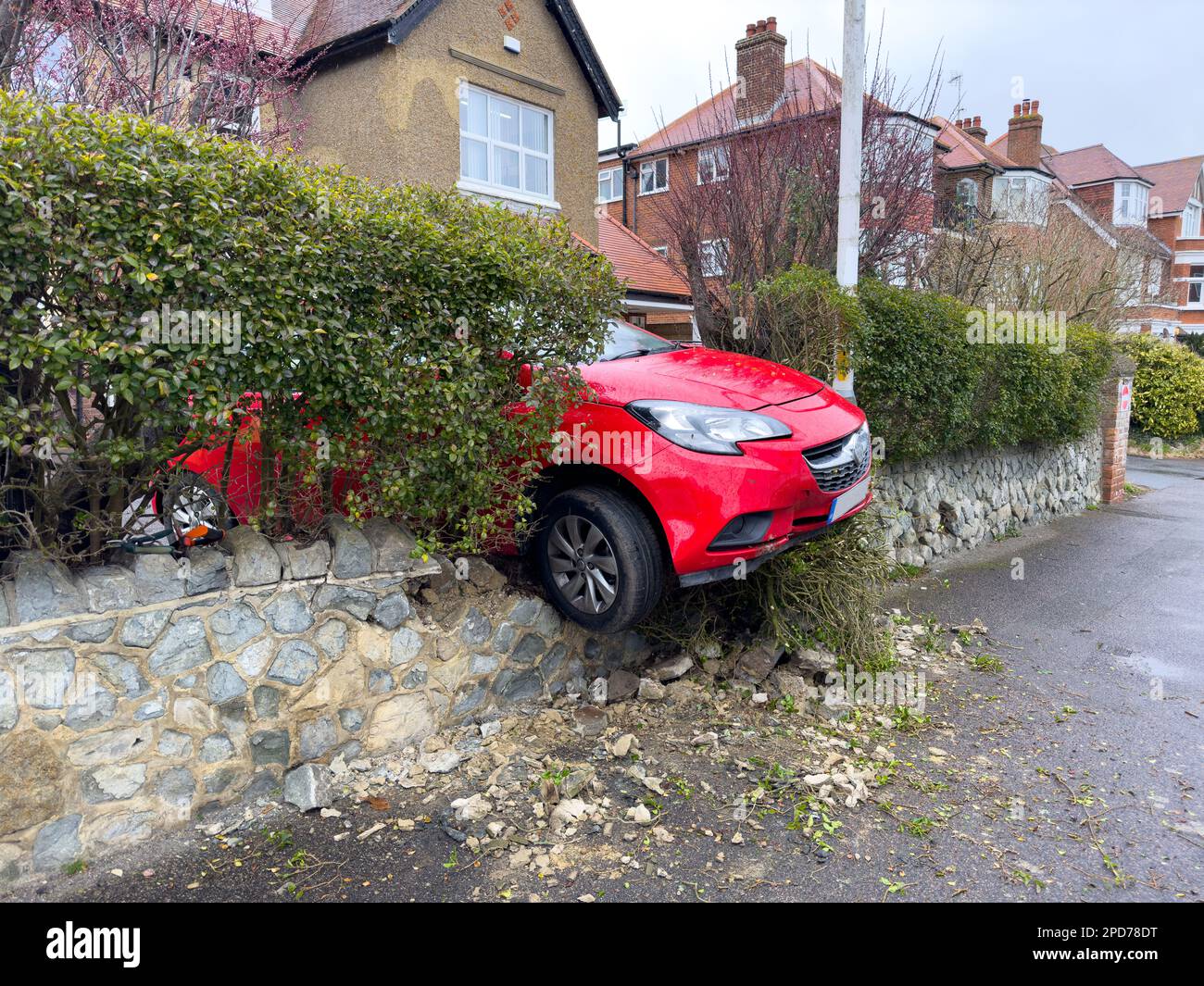 A car accident with a car having crashed through a wall Stock Photo - Alamy