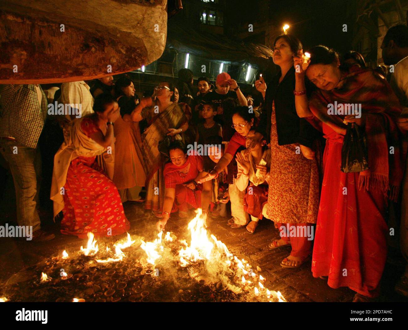 Devout Hindus offer prayers to celebrate the festival of Dasai in ...