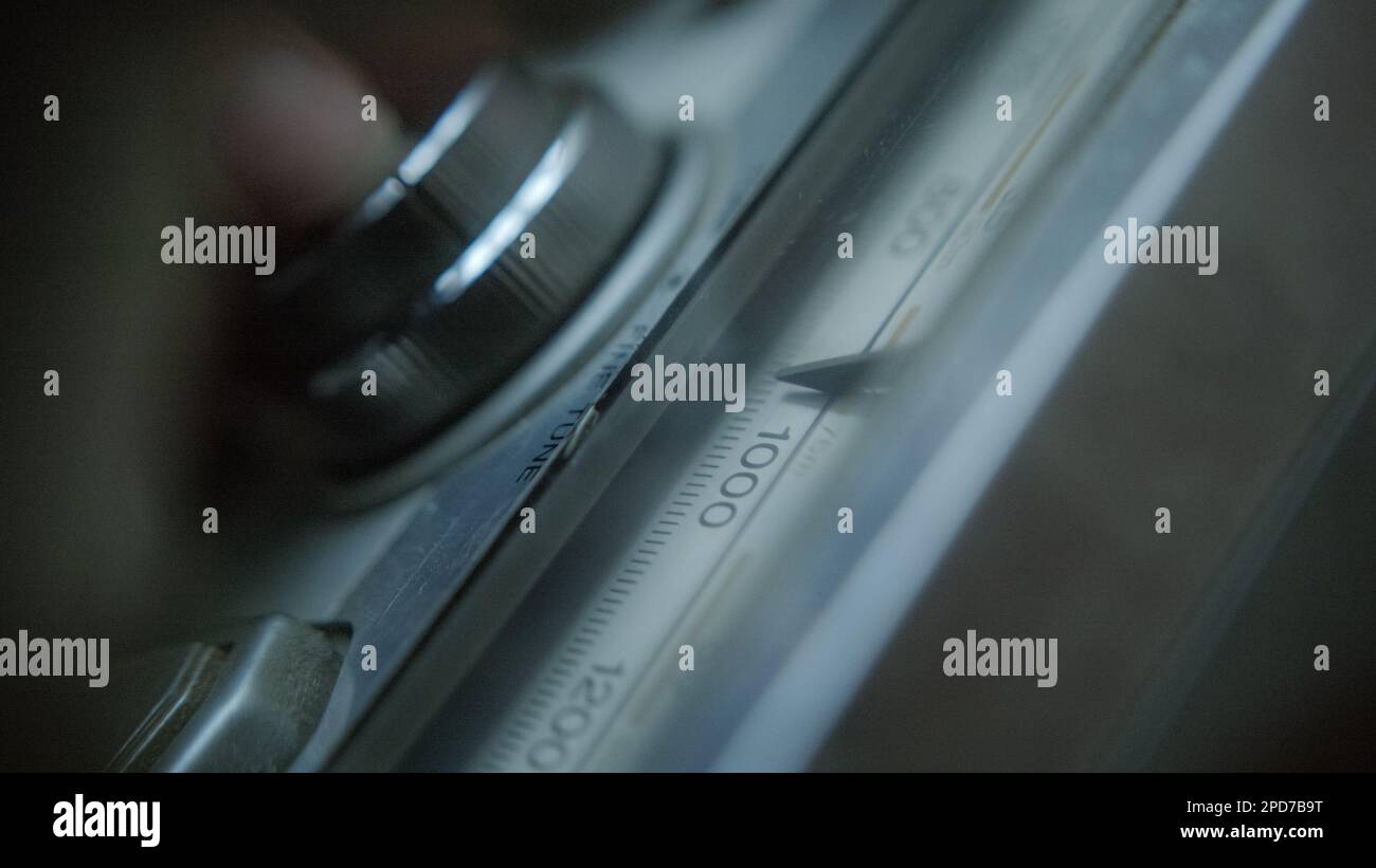 Macro Close-up Shot of Human Fingers Turning Radio Channel Knob on ...