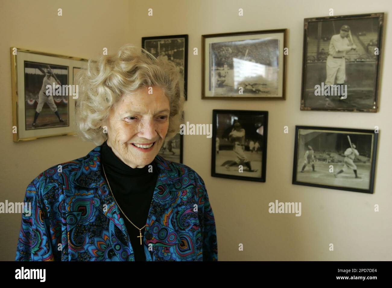 Julia Ruth Stevens, daughter of Babe Ruth, stands by photographs of her ...