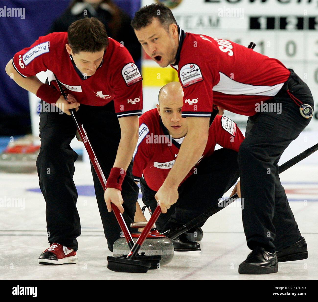 Switzerland's Pascal Sieber, center, delivers the rock as Simon ...