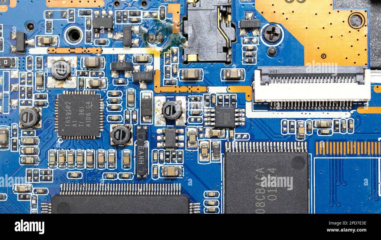 A close-up view of a computer motherboard showcasing numerous intricate components and circuitry ...